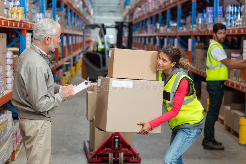 Worker Holding Cardboard Boxes Looking Her Manager Stock Image - Image ...