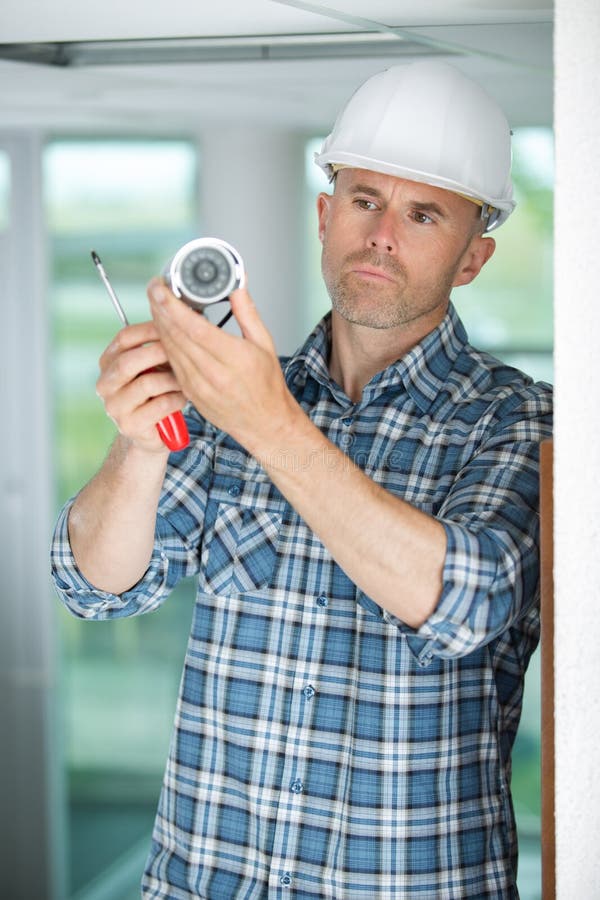 Worker holding cctv cam stock image. Image of wall, secure - 234517821