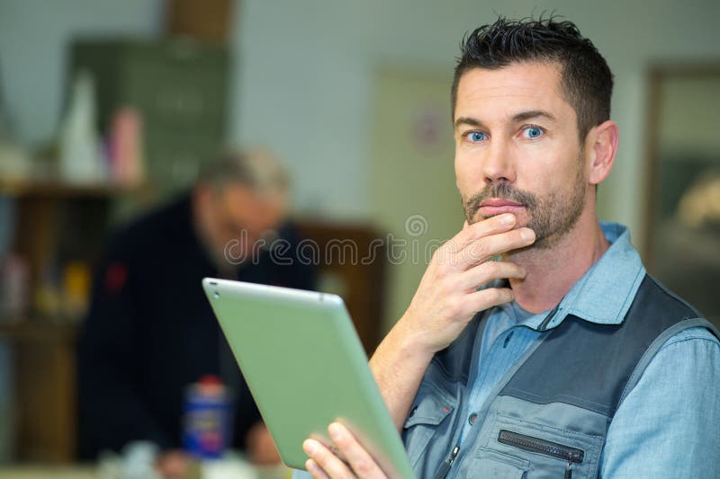 Worker Holding Digital Tablet in Warehouse Stock Photo - Image of ...
