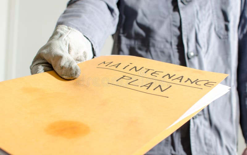 Worker Holding a Folder of Maintenance Plan and Tools Stock Image ...