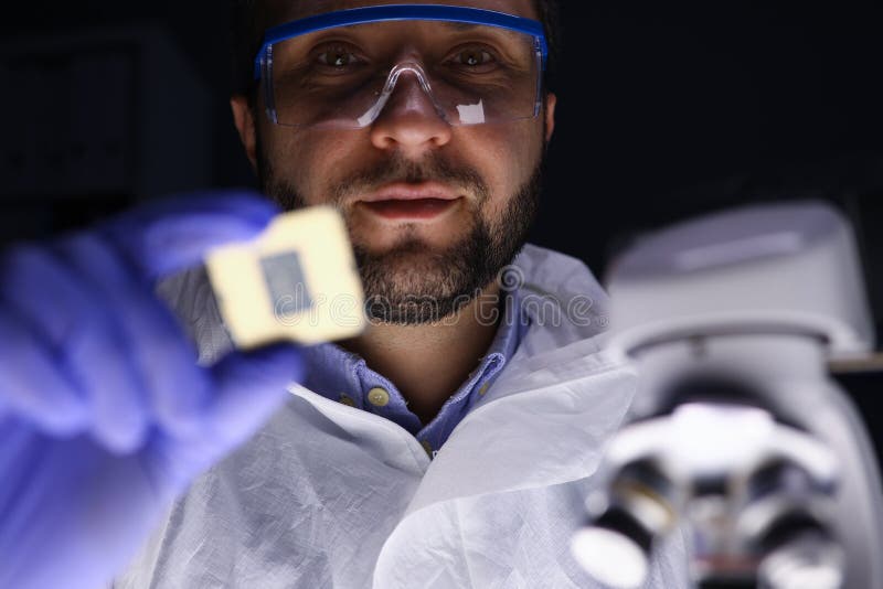 Worker holding microchip stock photo. Image of glass - 196311214