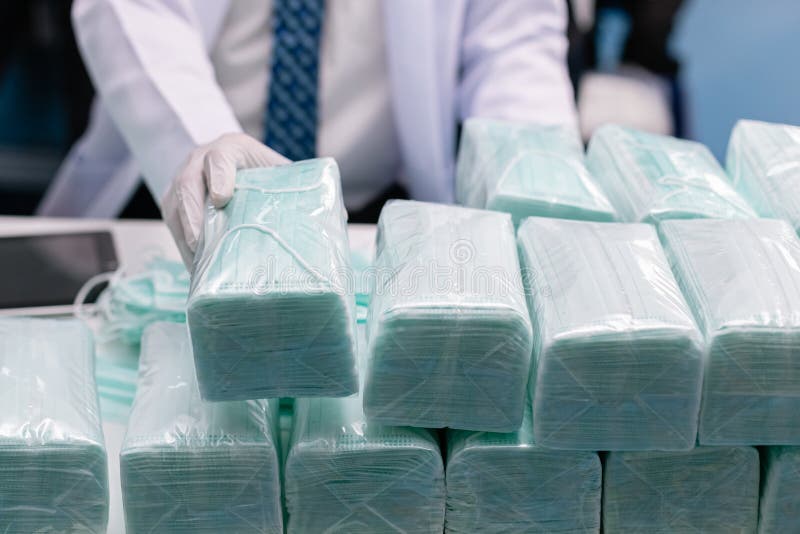 Worker Holding Package Sorting Face Mask in Production Factory Stock ...