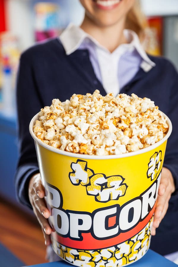 Worker Holding Popcorn Bucket at Cinema Stock Photo - Image of business ...