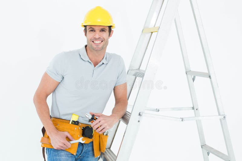 Worker Holding Tools while Leaning on Step Ladder Stock Photo - Image ...