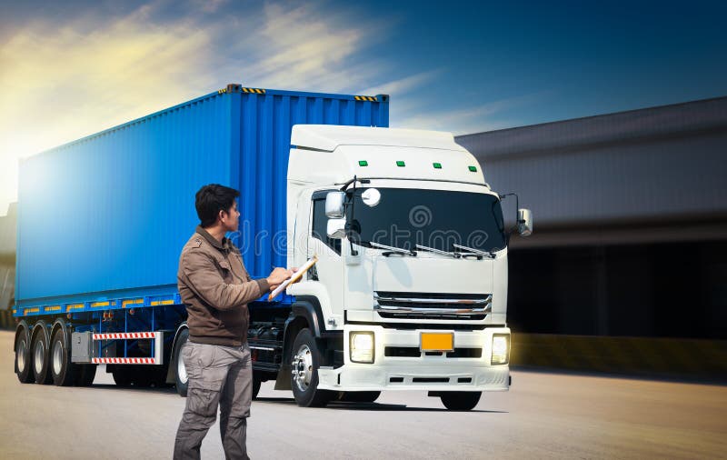 Worker Holds a Clipboard Checking the Loading of Trailer Truck. Freight ...