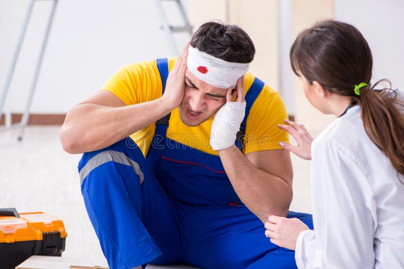 The Worker with Injured Head and Doctor Stock Photo - Image of headache ...