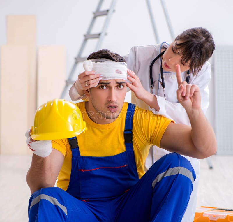 Worker with Injured Head and Doctor Stock Photo - Image of industry ...