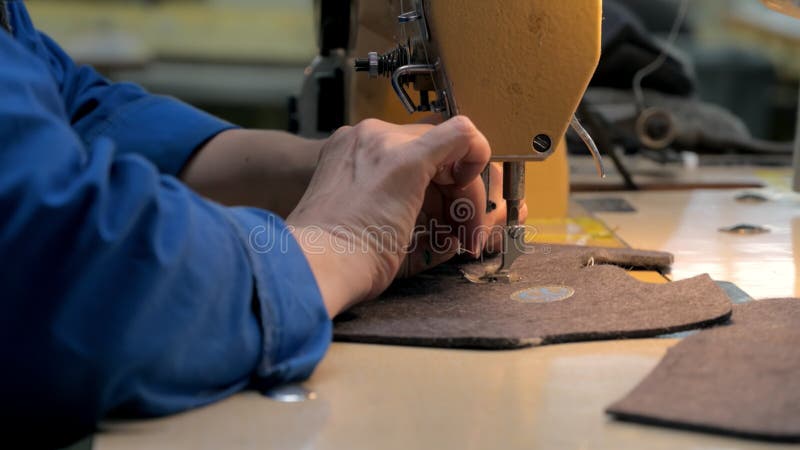 Worker Inputs Thread into Sewing Machine Needle at Workplace Stock ...