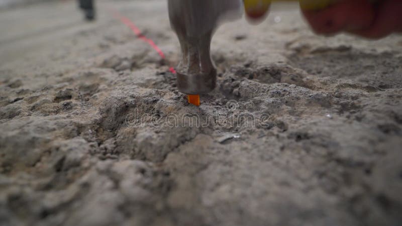 Construction Worker Placing Plastic Anchor into Concrete Floor Stock ...
