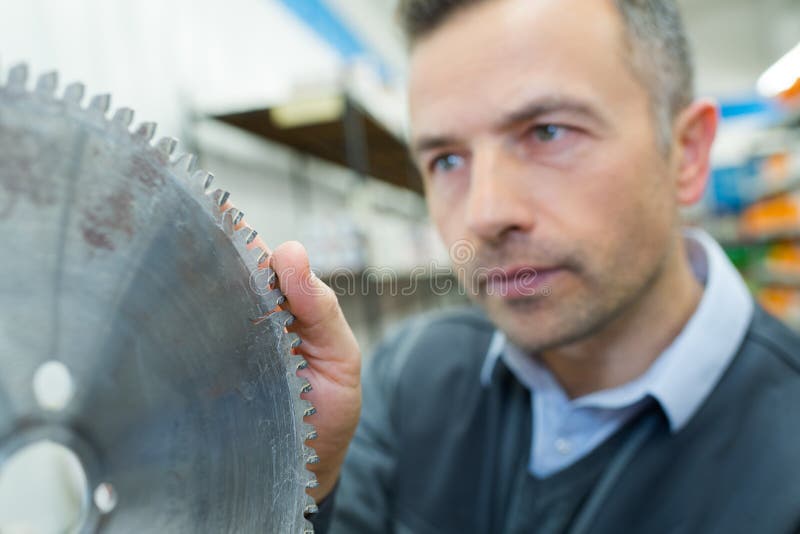 Worker Inspecting Blade Circular Saw Stock Photo - Image of hardware ...