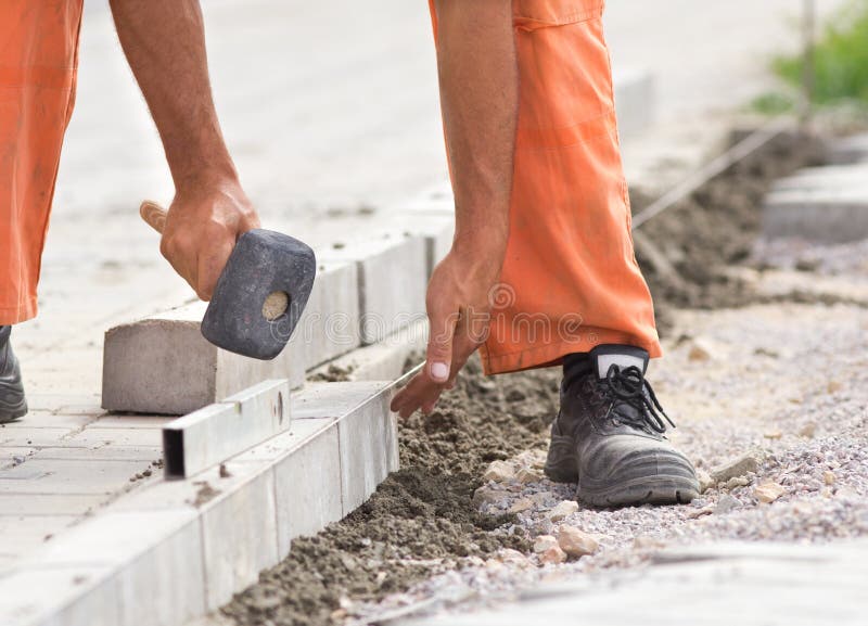 Worker Instaling Roadside Blocks Stock Image - Image of equipment ...