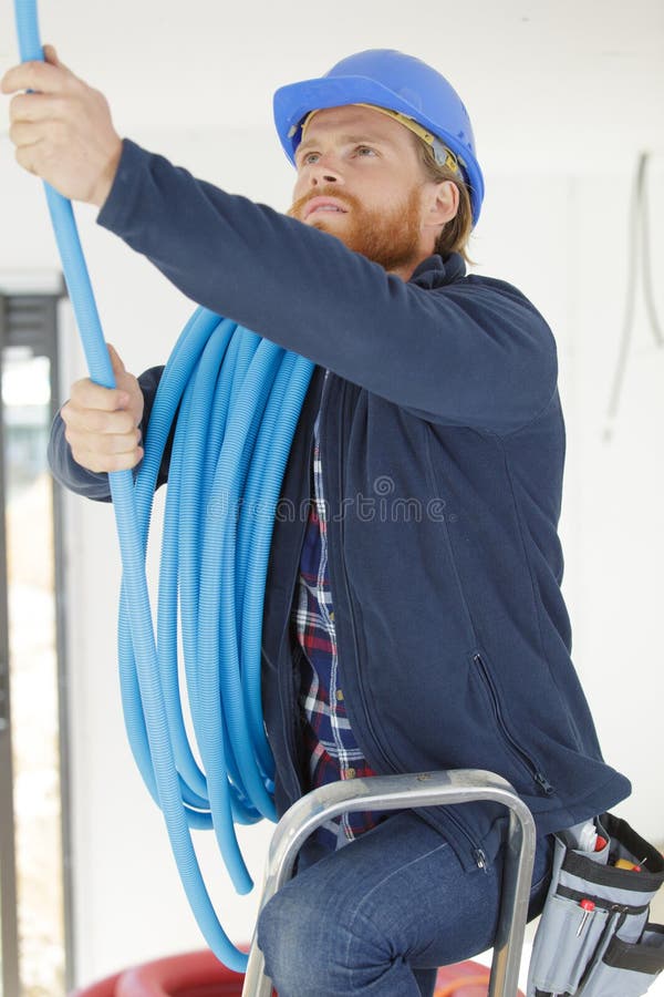 Worker Installing Cable Internet Wire in Ceiling Stock Image - Image of ...