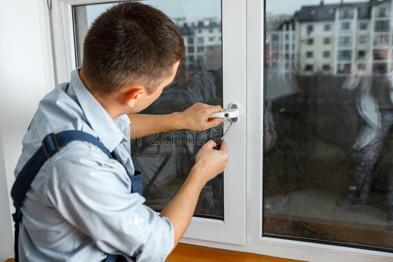 The Worker Installing and Checking Window in the House Stock Photo ...