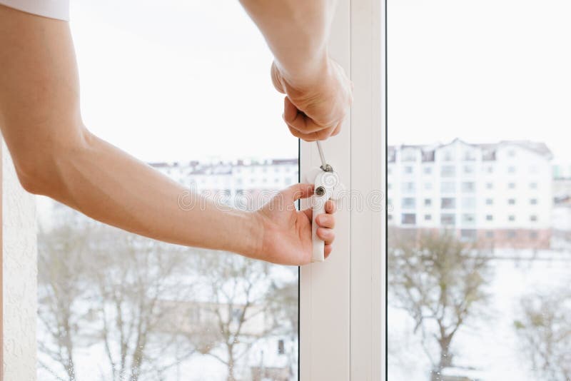 The Worker Installing and Checking Window in the House Stock Photo ...