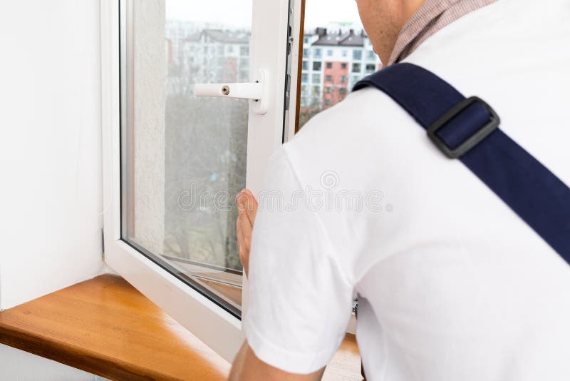 The Worker Installing and Checking Window in the House Stock Image ...