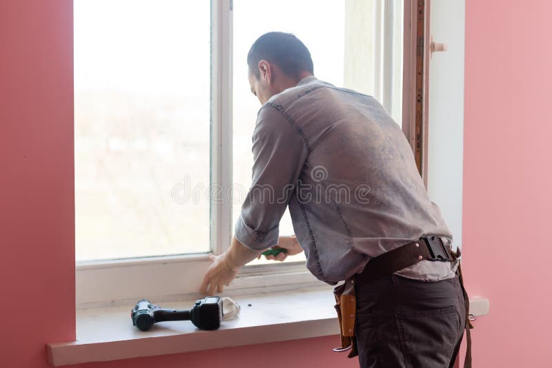 The Worker Installing and Checking Window in the House Stock Image ...
