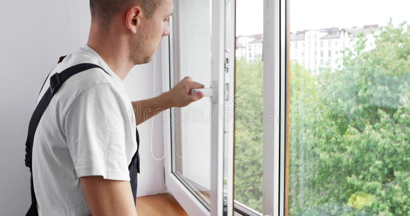 The Worker Installing and Checking Window in the House Stock Footage ...