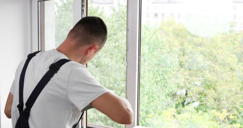 The Worker Installing and Checking Window in the House Stock Footage ...