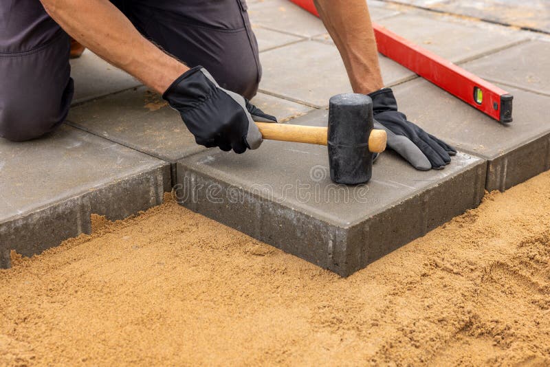 Worker Installing Concrete Paving Slabs Stock Image - Image of paver ...