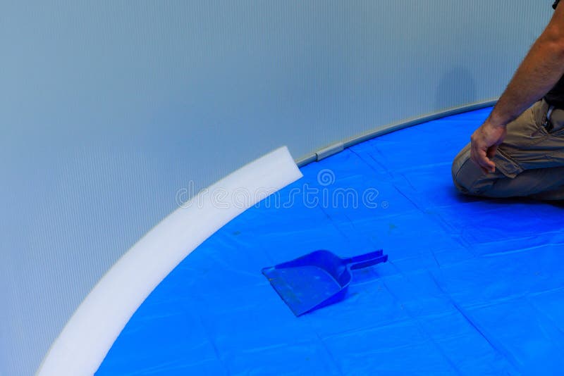 Worker Installing Durable Foam Construction To Provide Protection for a ...