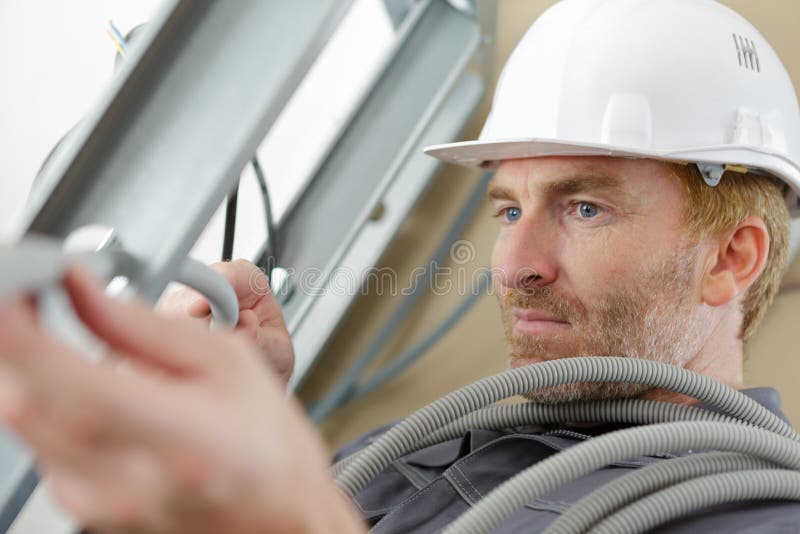 Worker Installing Electric Cable Stock Photo - Image of gloves, indoors ...