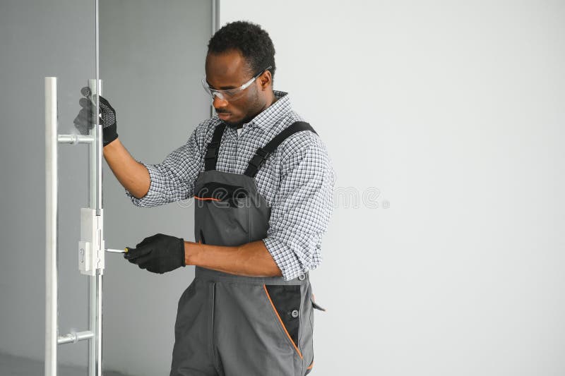 Worker Installing Glass Door at Office Stock Image - Image of apartment ...