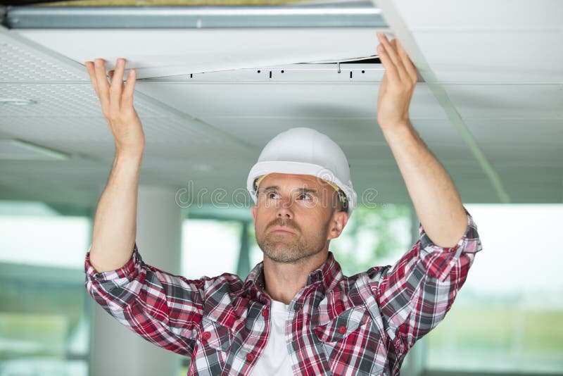 Worker Installing Gypsum Ceiling Board Stock Photo - Image of interior ...