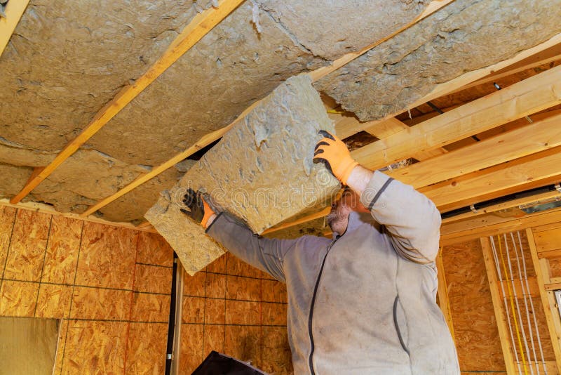 Worker Installing Insulation Panels in a Residential Construction ...