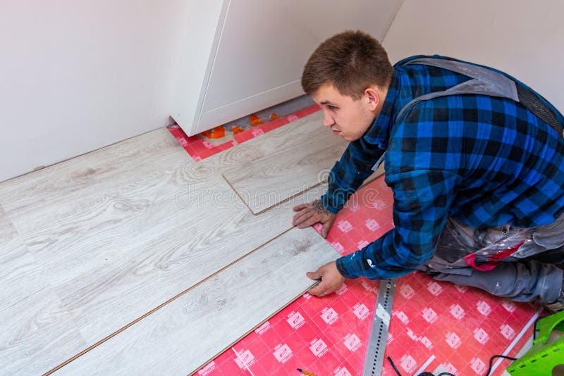 Worker Installing Laminate Floor Panels Stock Image - Image of decor ...