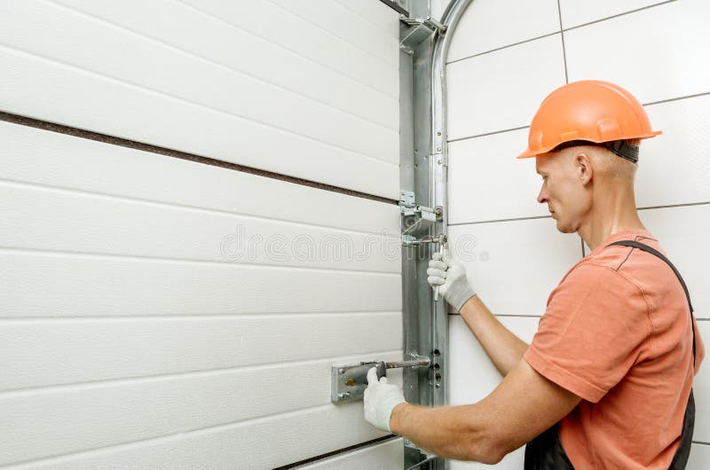 Worker is Installing Lift Gates in the Garage Stock Photo - Image of ...