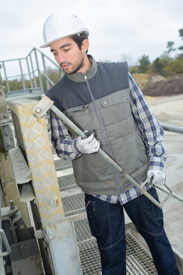 Worker Installing Machine Outdoors Stock Photo - Image of retaining ...