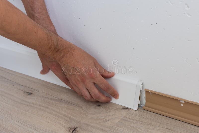 Worker Installing Plastic Skirting Board Stock Image - Image of ...