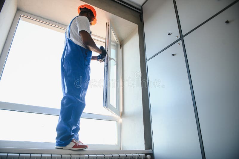 Worker Installing Plastic Window Indoors Stock Photo - Image of glass ...
