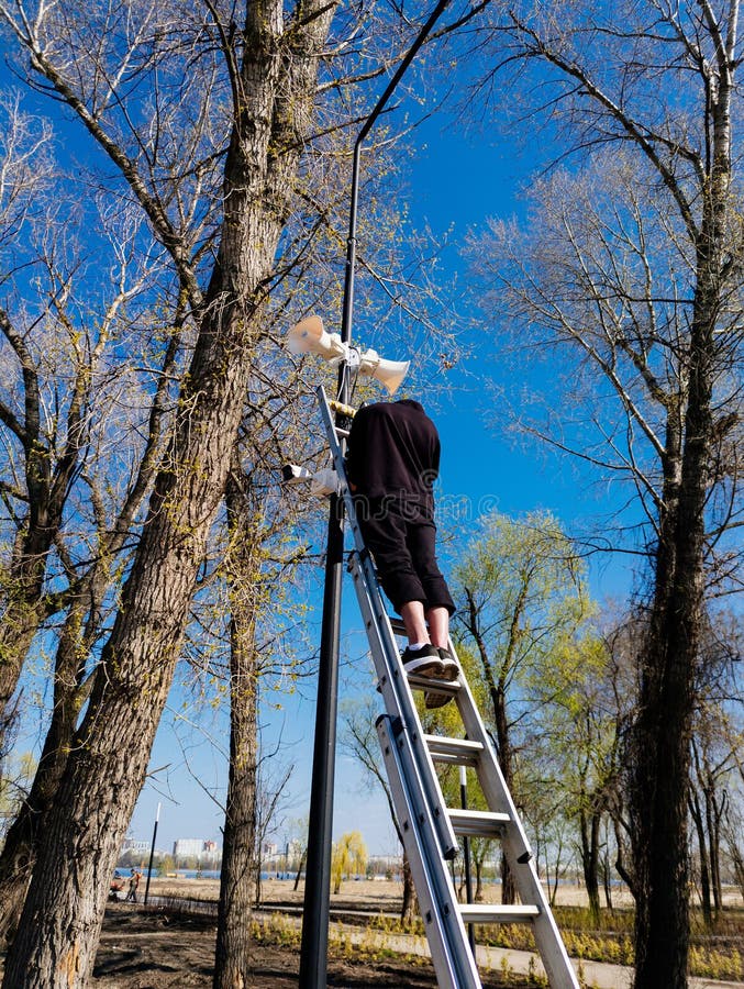 Worker Installing Security Camera on Lamp Post Stock Image - Image of ...