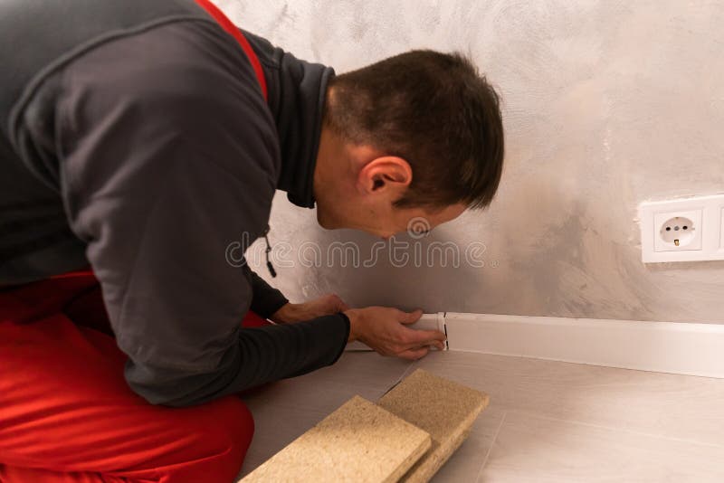 Worker Installing Skirting Board, Baseboard Stock Image - Image of ...