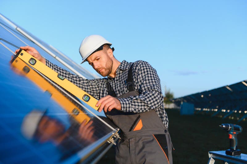 Worker Installing Solar Panel on Metal Beams at Sunny Daytime ...
