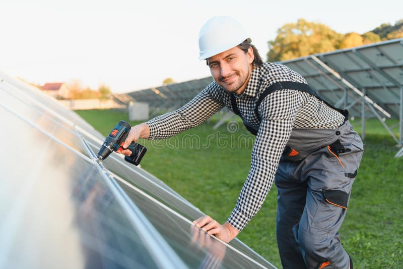 Worker Installing Solar Panel on Metal Beams at Sunny Daytime ...
