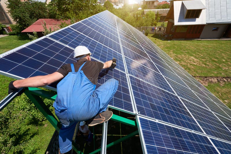 Worker Installing Solar Panel Screen during Sunny Day. Stock Photo ...