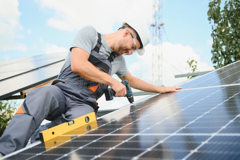 Worker Installing Solar Panels Outdoors Stock Photo - Image of ...