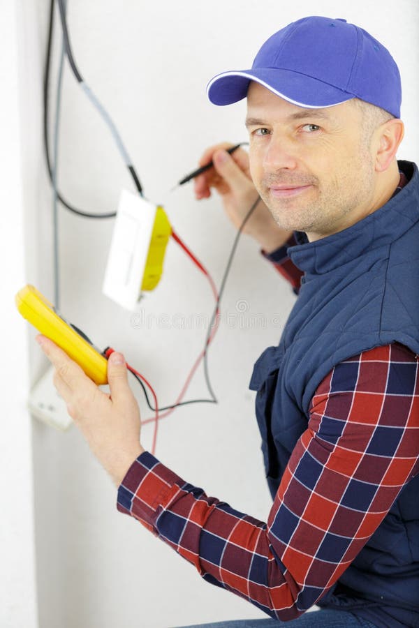 Worker Installing Television Cable Internet Wire in Room Stock Photo ...
