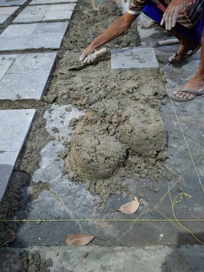 Worker installing tiles stock photo. Image of occupation - 122487852