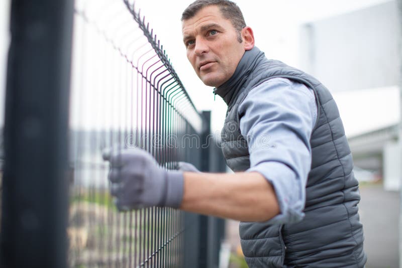 Worker Installing Welded Metal Mesh Fence Stock Image - Image of panel ...