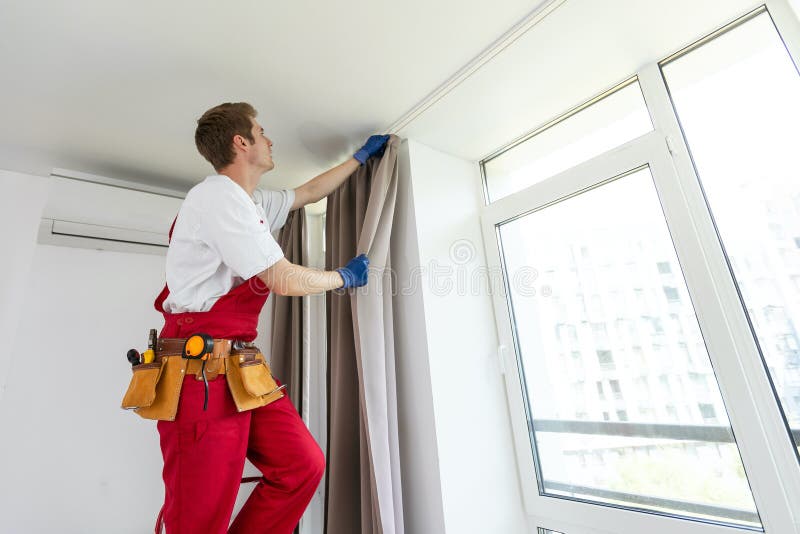 Worker Installing Window Curtain Rod on the Wall Stock Image - Image of ...