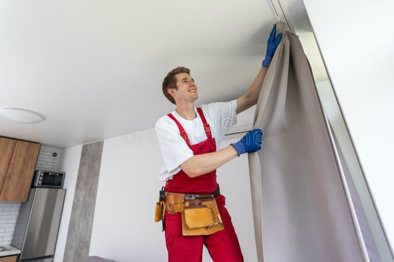 Worker Installing Window Curtain Rod on the Wall Stock Image - Image of ...