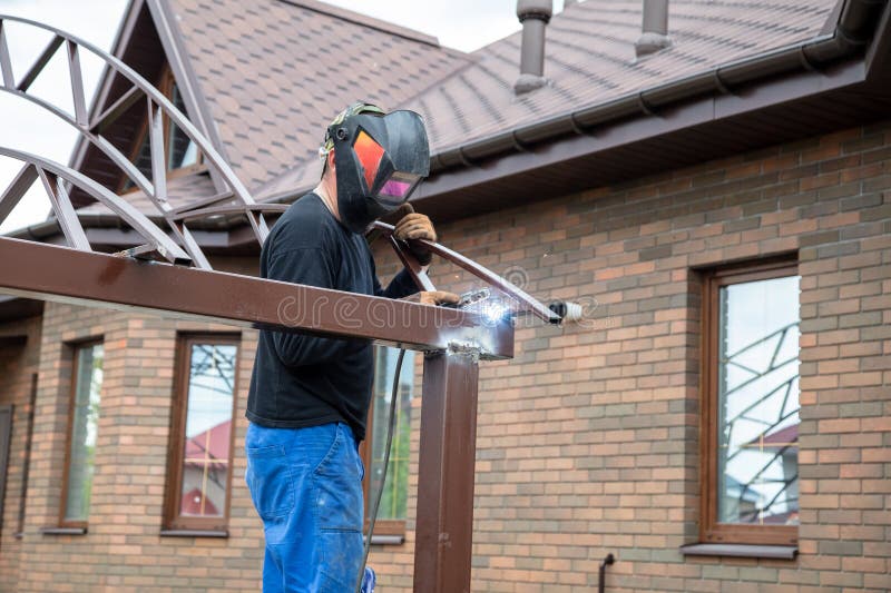 The Worker Installs the Metal on the Canopy. Stock Image - Image of ...