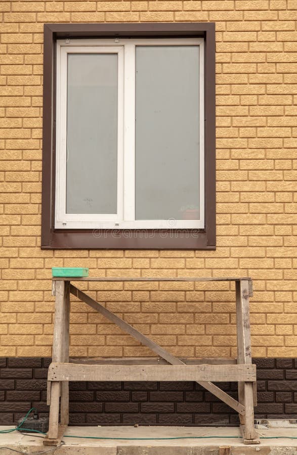 The Worker Installs a Metal Window in the House Stock Photo - Image of ...