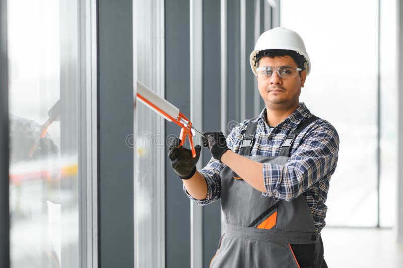 The Worker Installs a Window Frame in the Room Stock Photo - Image of ...