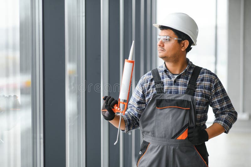 The Worker Installs a Window Frame in the Room Stock Photo - Image of ...