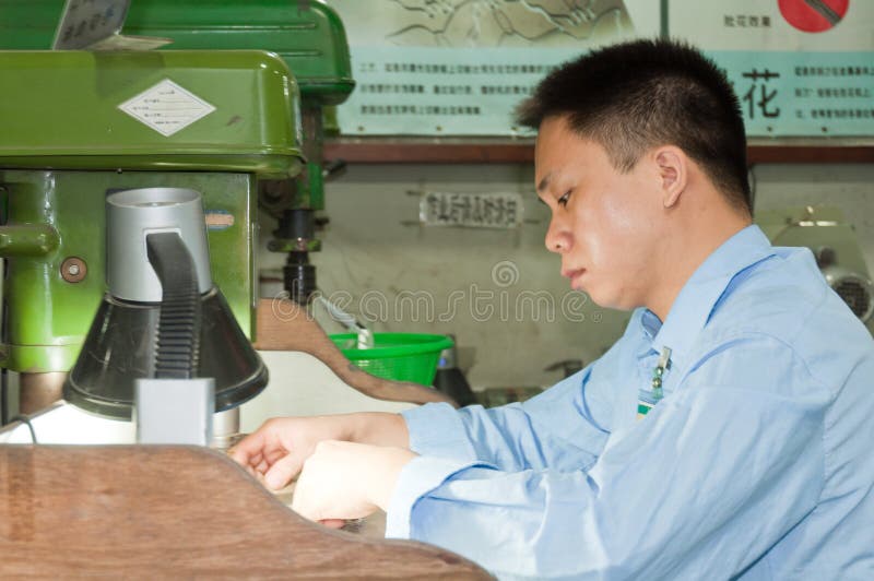 A worker of jewelry editorial photography. Image of asia - 21607422