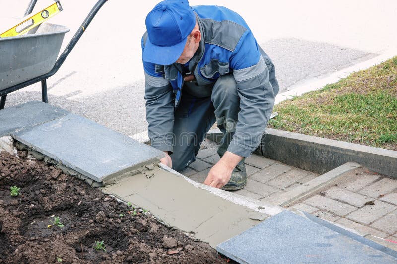 Worker Kneeling and Smoothing Mortar Edge Stock Photo - Image of ...